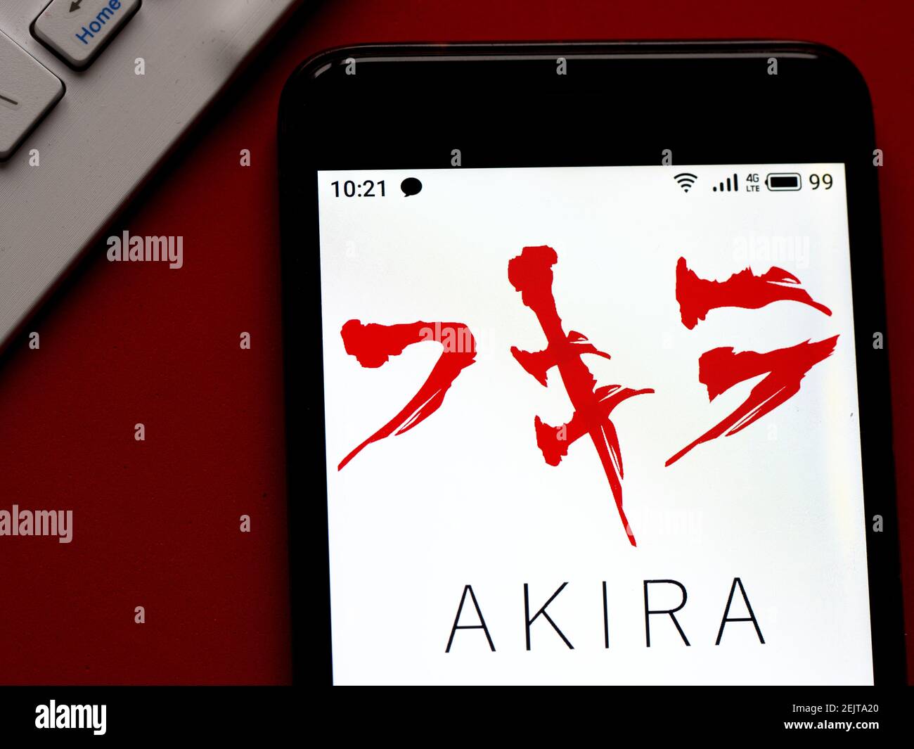 In this photo illustration an Akira logo seen displayed on a smartphone ...