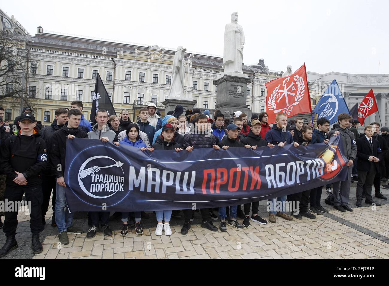 Far-right activists holding a banner during the march. Under the slogan ...