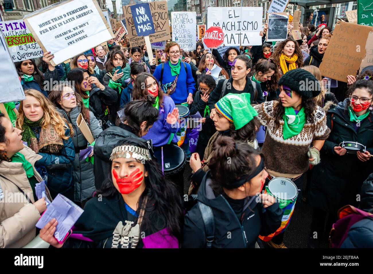 A group of Latin women play music during the march. During the ...