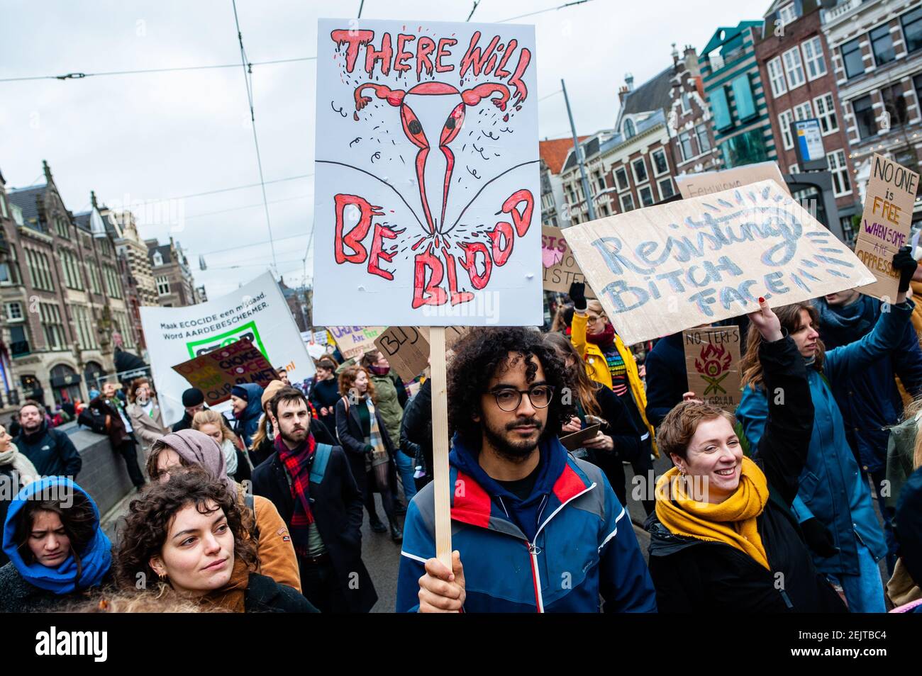 Protesters hold placards during the demonstration. During the ...
