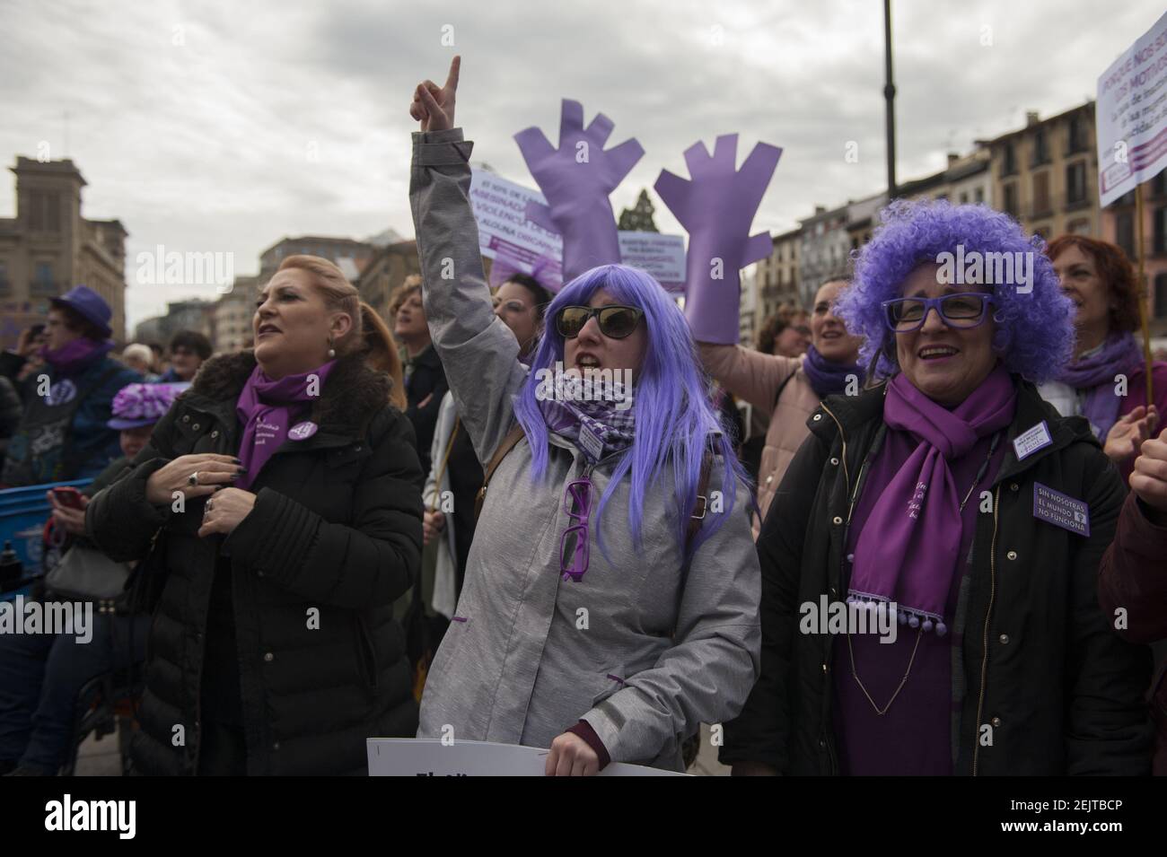 Women dressed in purple wigs during the demonstration. Hundreds of ...