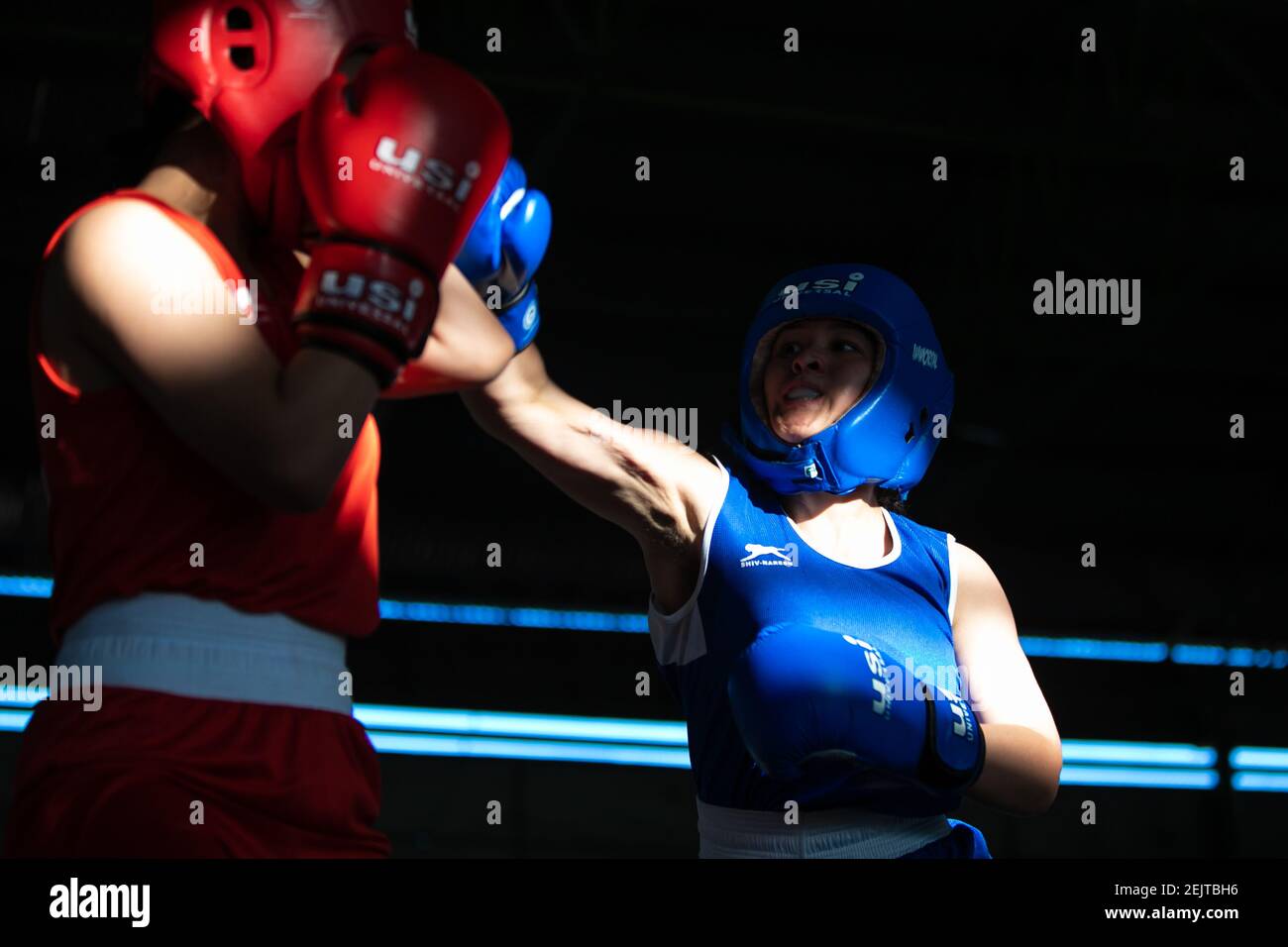 Nepalese woman boxer in blue jersey, Roshani Rai punches Sumina Khadka ...