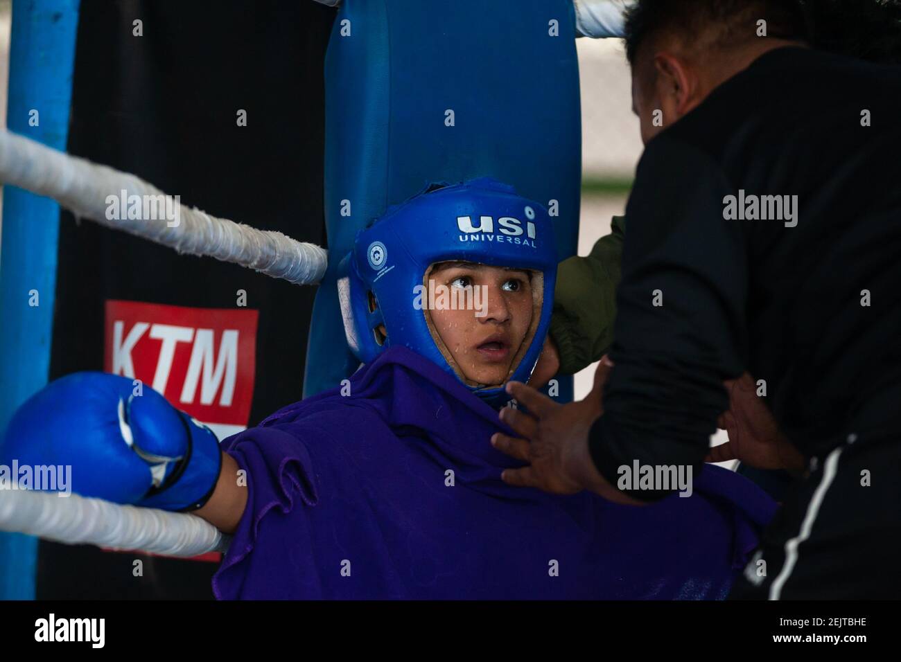 A coach giving instruction to Nepalese woman boxer, Sushma Tamang ...