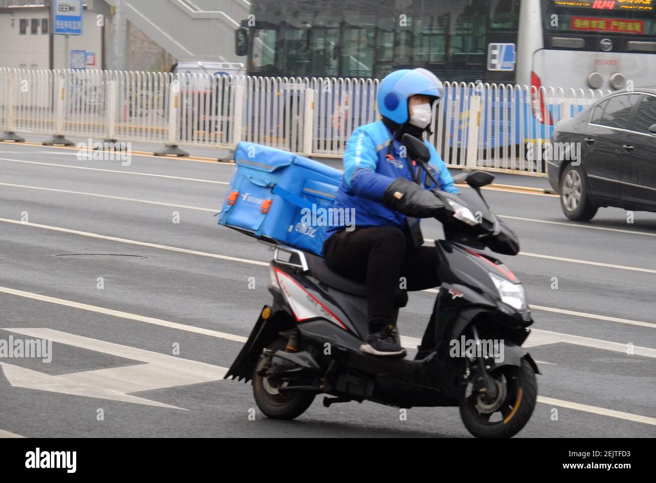 Beijing,CHINA-Couriers and delivery riders deliver food to consumers in ...