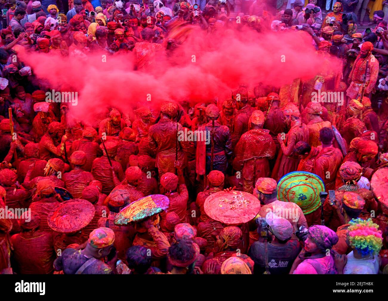 Hindu devotees covered with colorful (Vermilion powder) during the ...