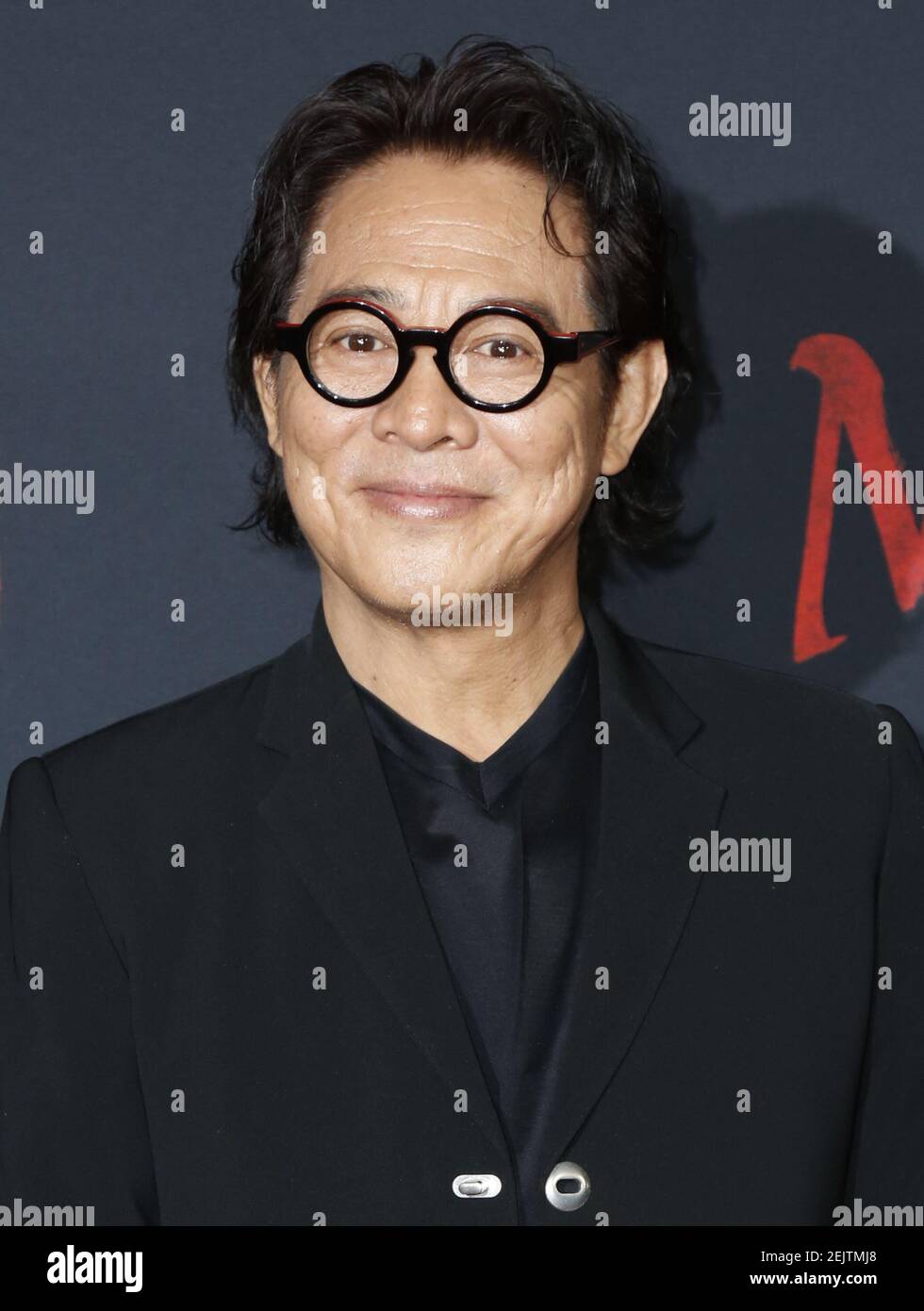Jet Li walking the red carpet at Premiere Of Disney's "Mulan" held at ...