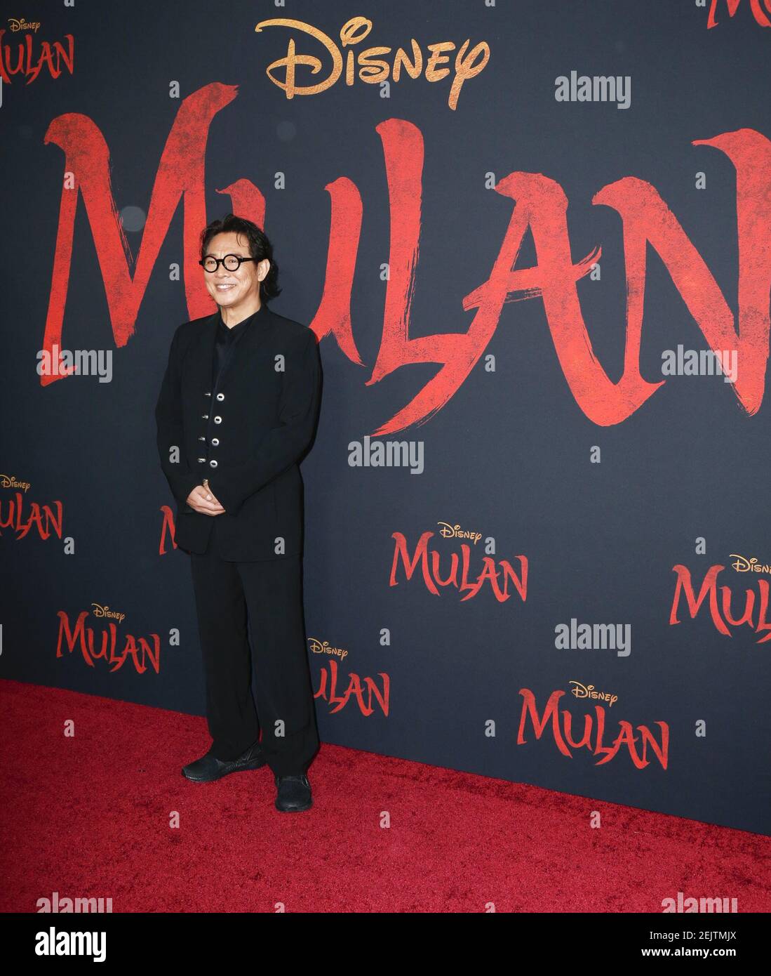 Jet Li walking the red carpet at Premiere Of Disney's "Mulan" held at ...