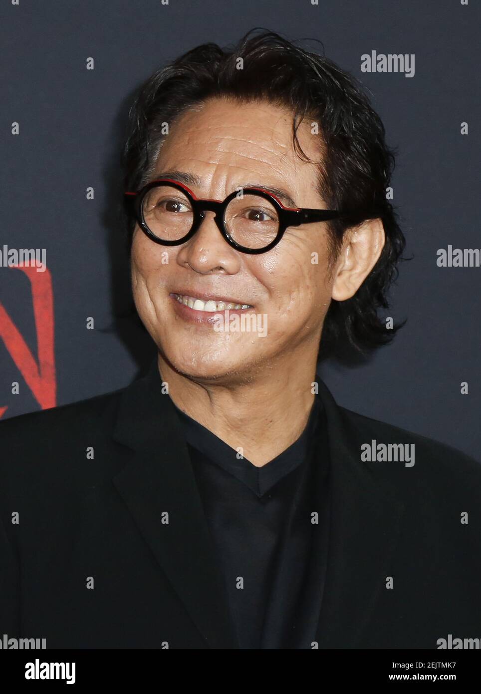 Jet Li walking the red carpet at Premiere Of Disney's "Mulan" held at ...