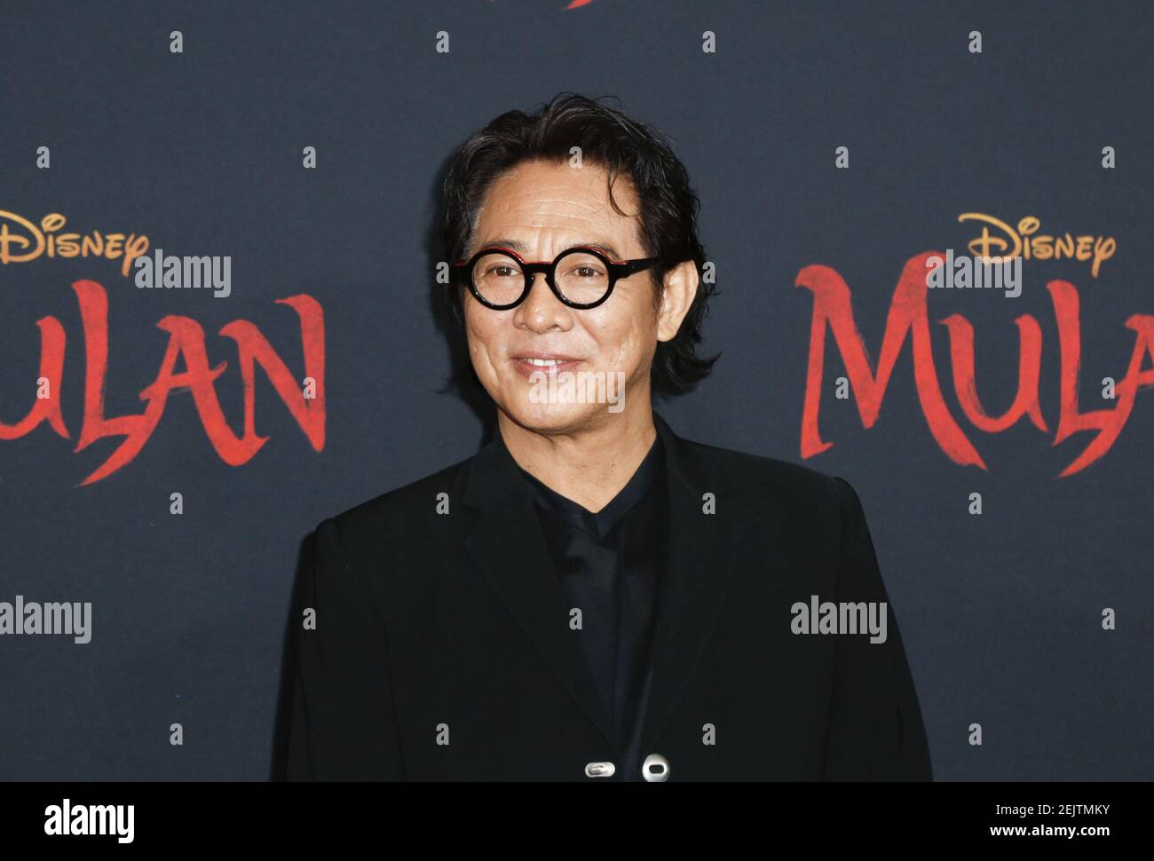 Jet Li walking the red carpet at Premiere Of Disney's "Mulan" held at ...