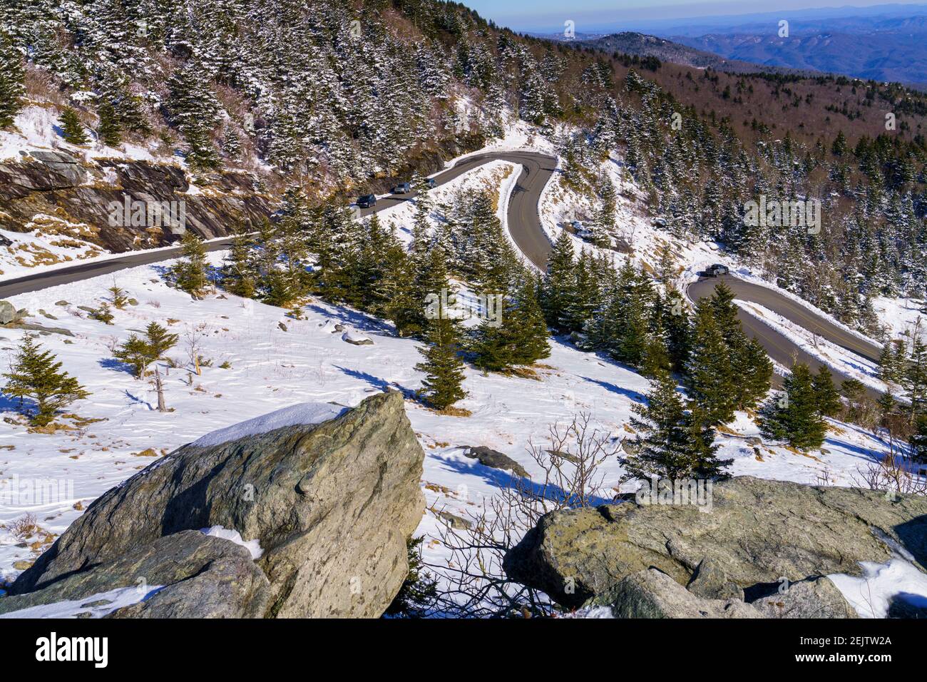 The snow covered landscape of the road leading up Grandfather Mountain ...