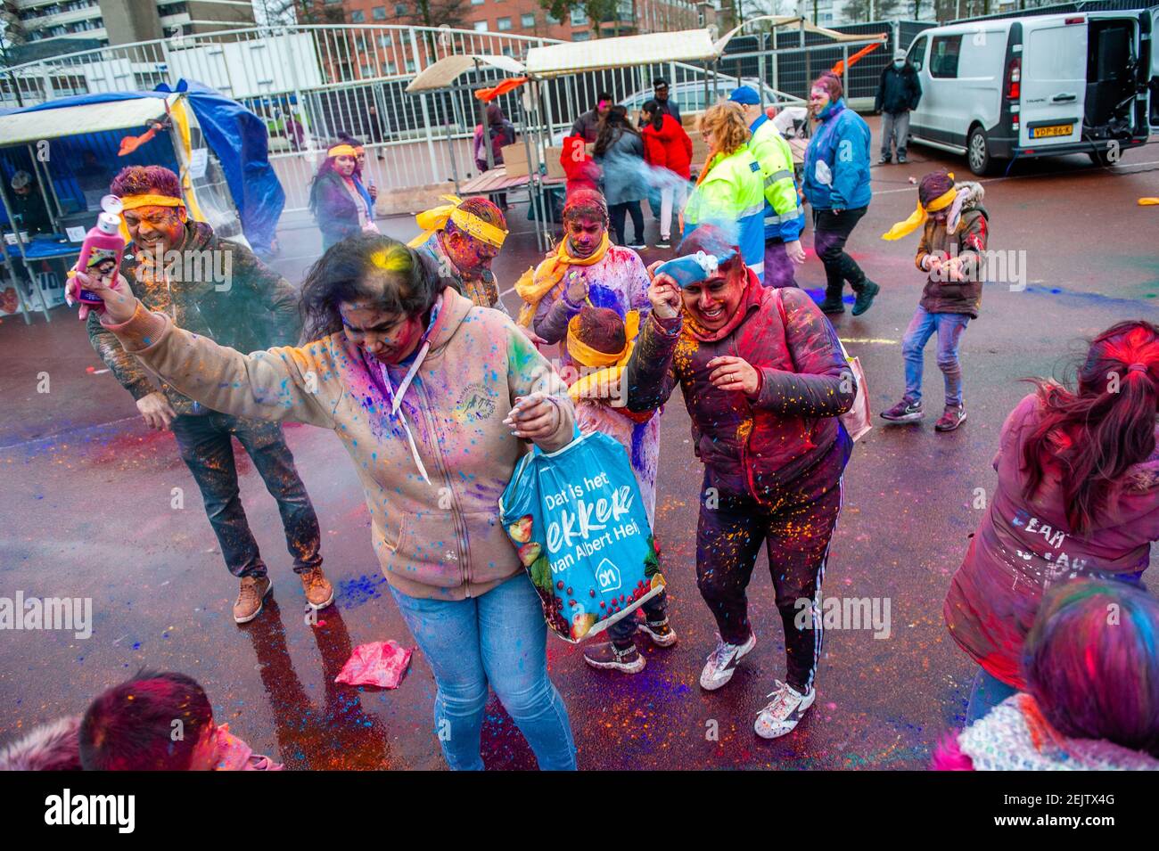 An Indian family throwing colour powder during the celebrations ...