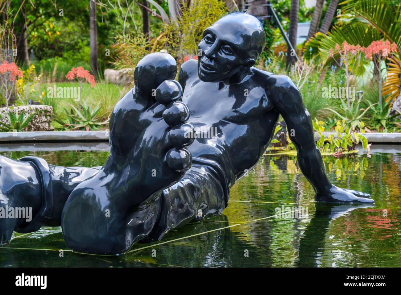 The symbolic statue of an African, Big Foot, in a pond at the Miami ...