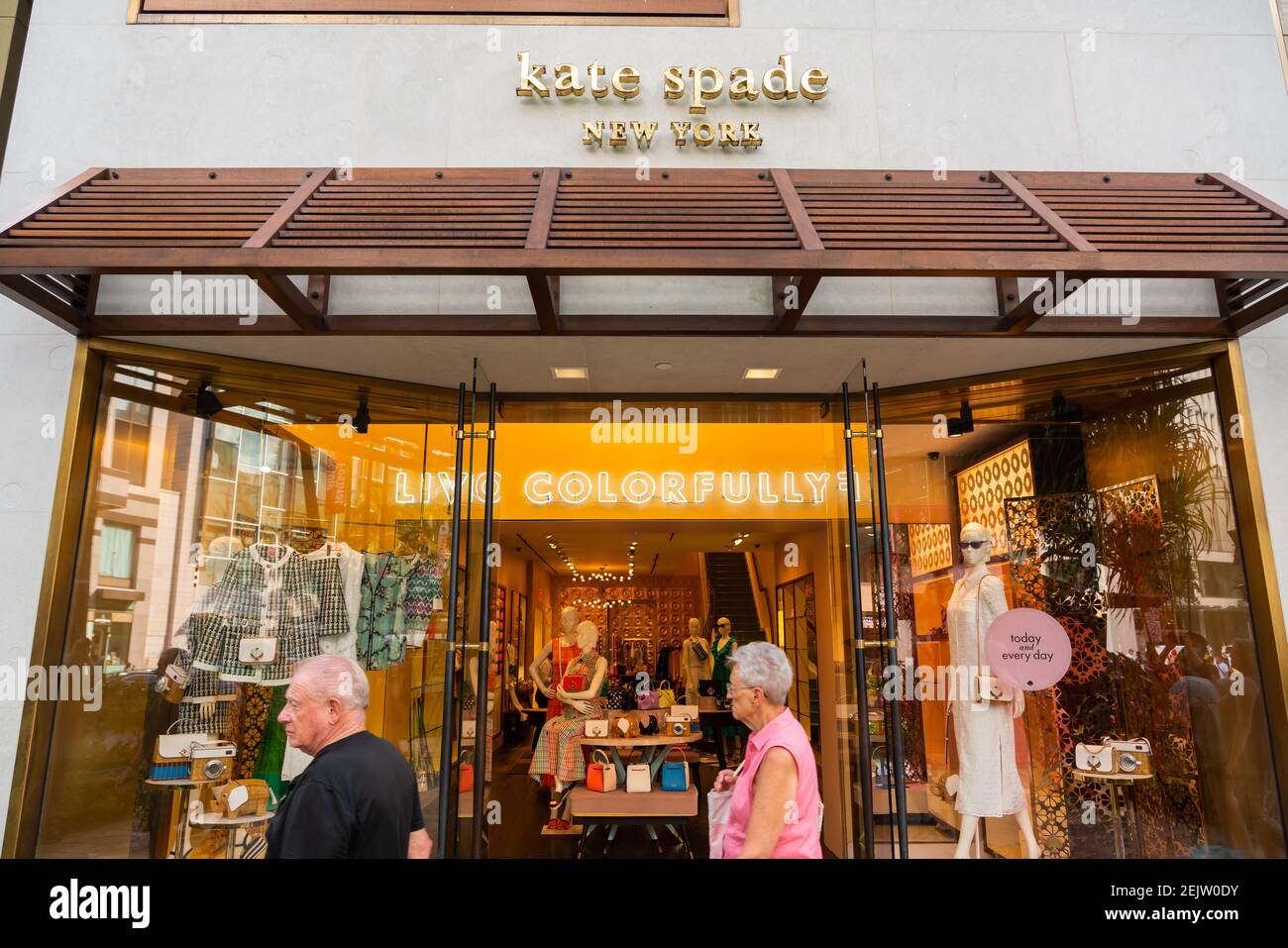 Pedestrians walk past an american luxury fashion design house Kate ...