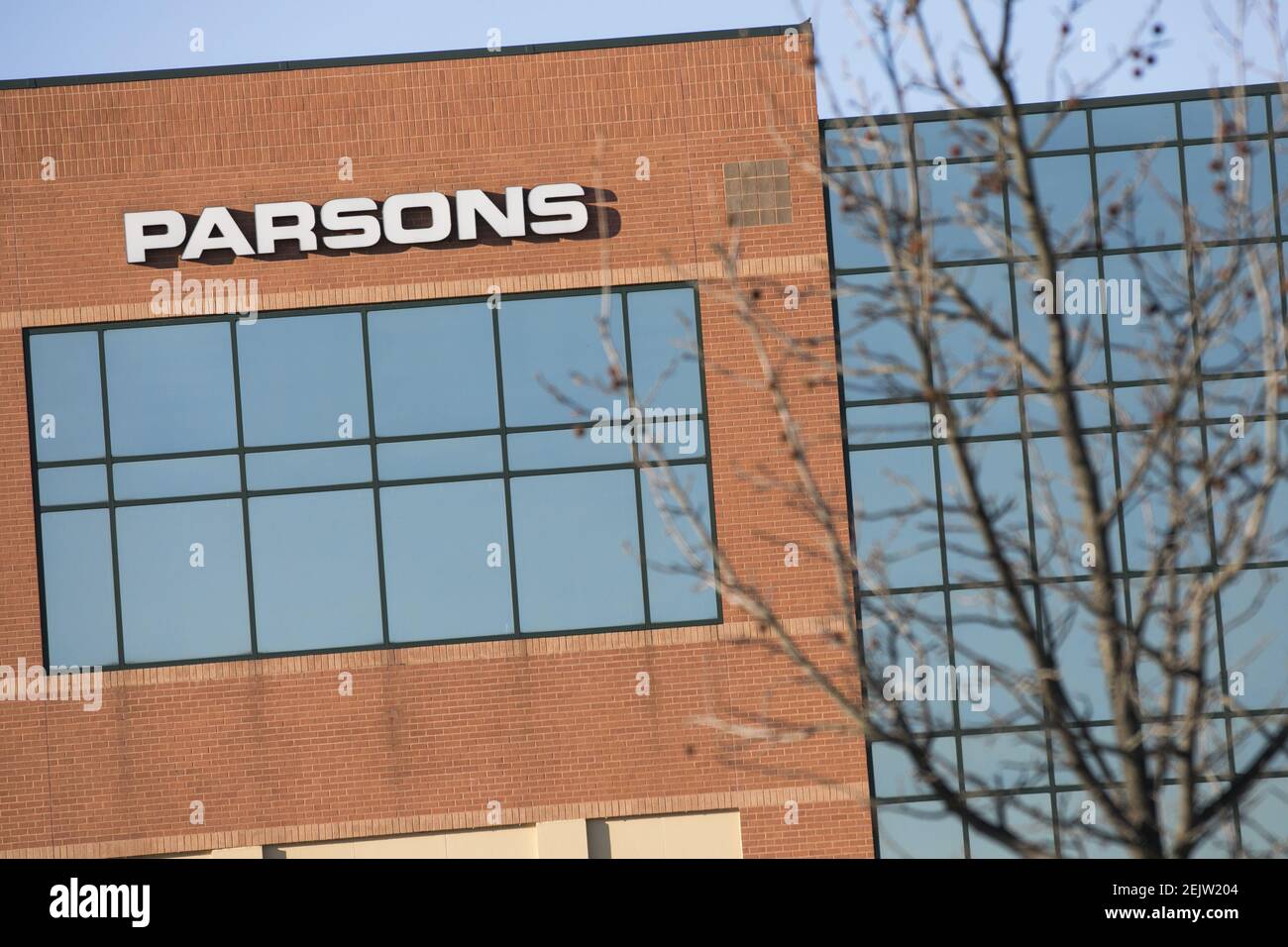 A logo sign outside of a facility occupied by Parsons Corporation in ...