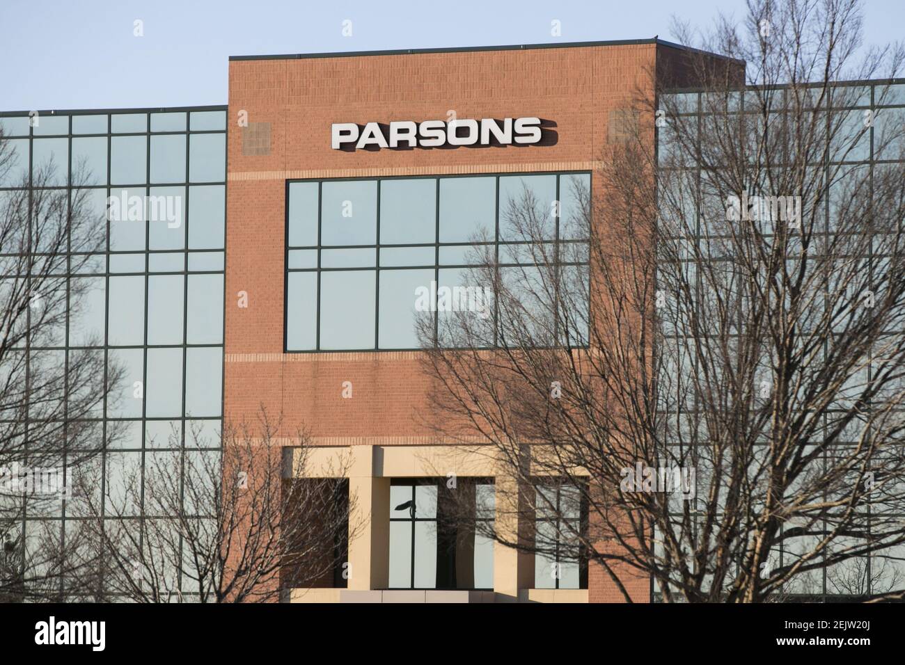A logo sign outside of a facility occupied by Parsons Corporation in ...