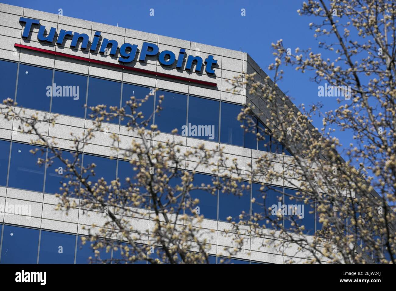 A logo sign outside of the headquarters of TurningPoint Global ...