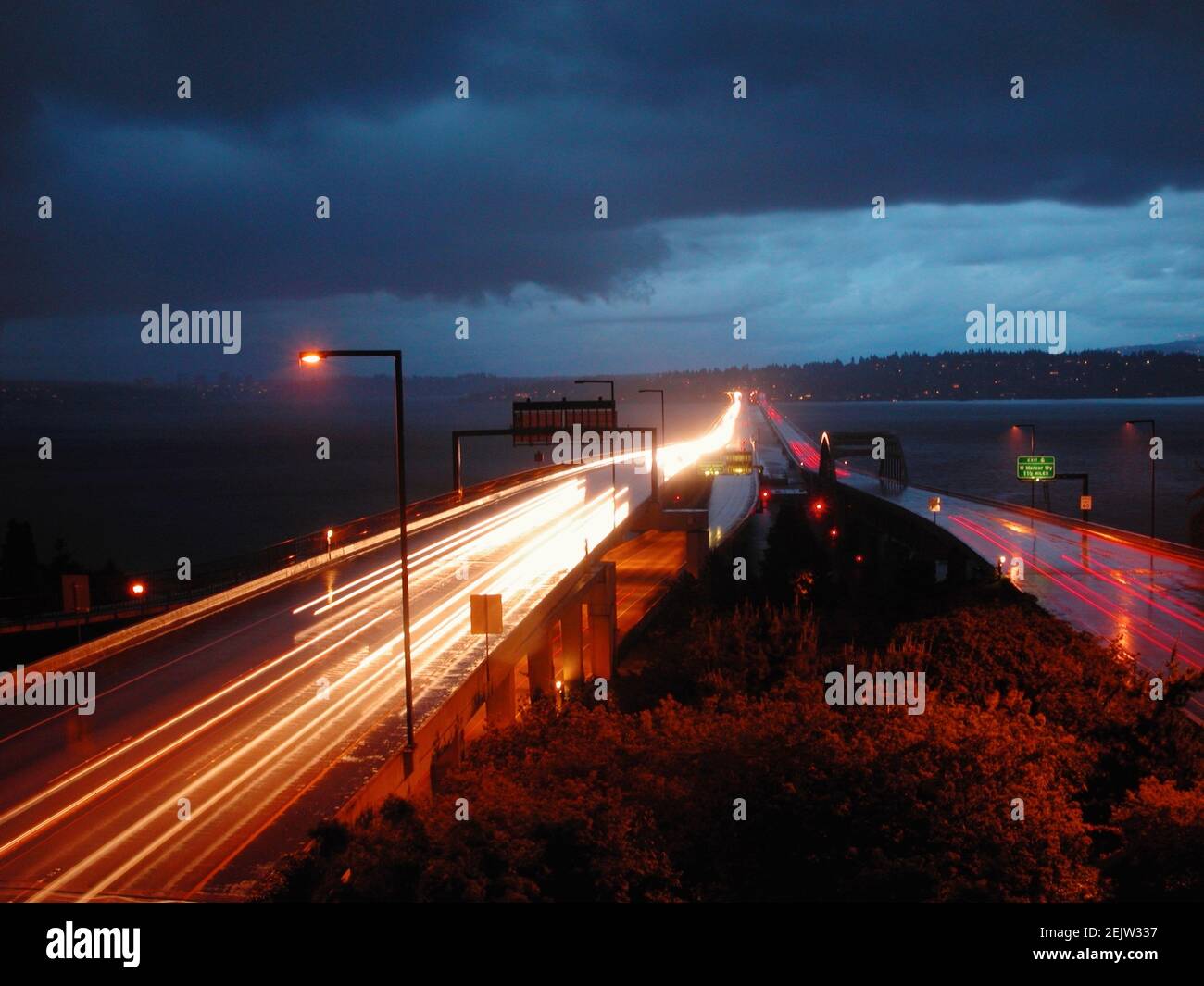 I-90 Floating Bridge at dusk with storm clouds rolling in Stock Photo ...
