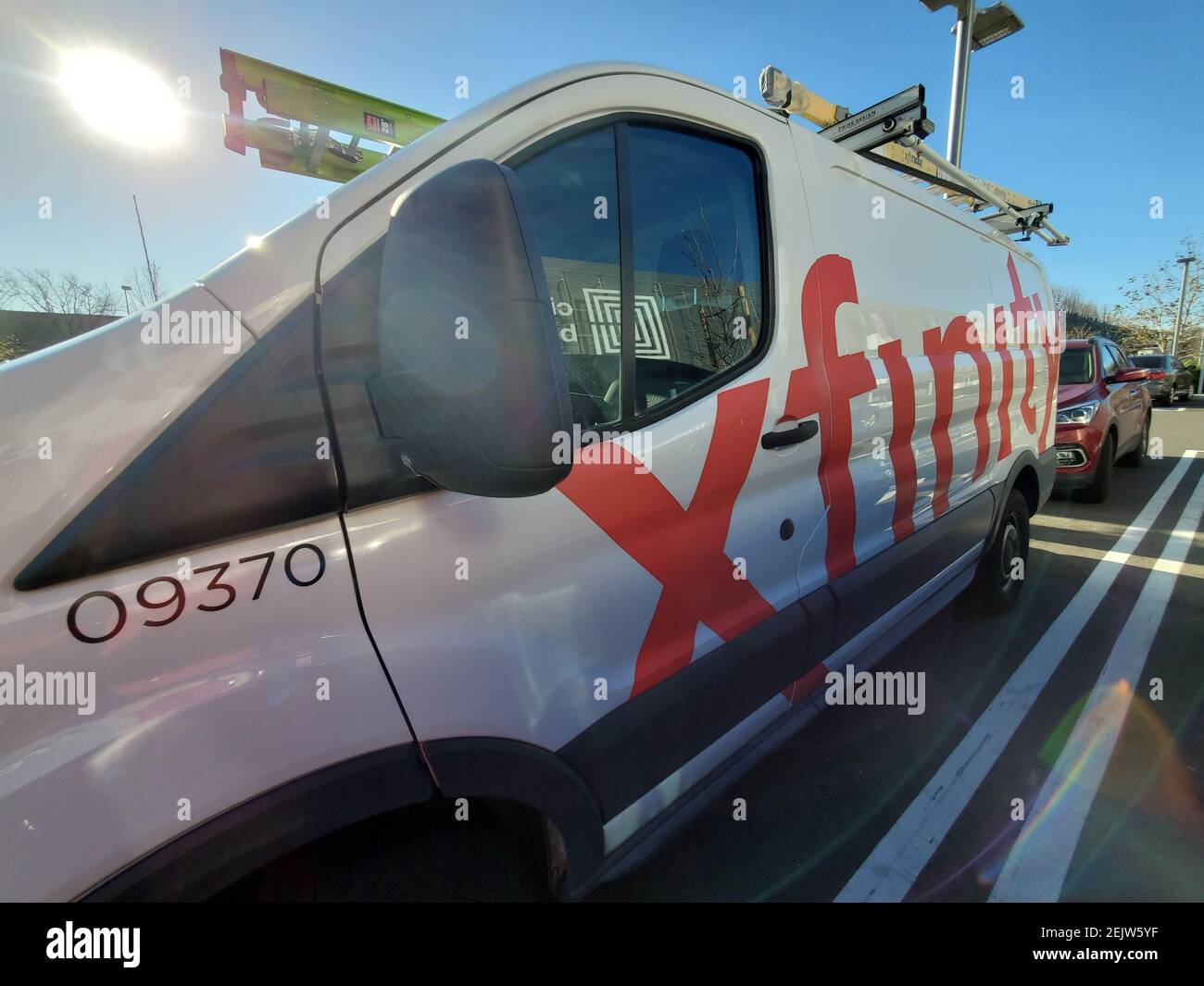Side view of truck with logo for Xfinity, a division of internet ...