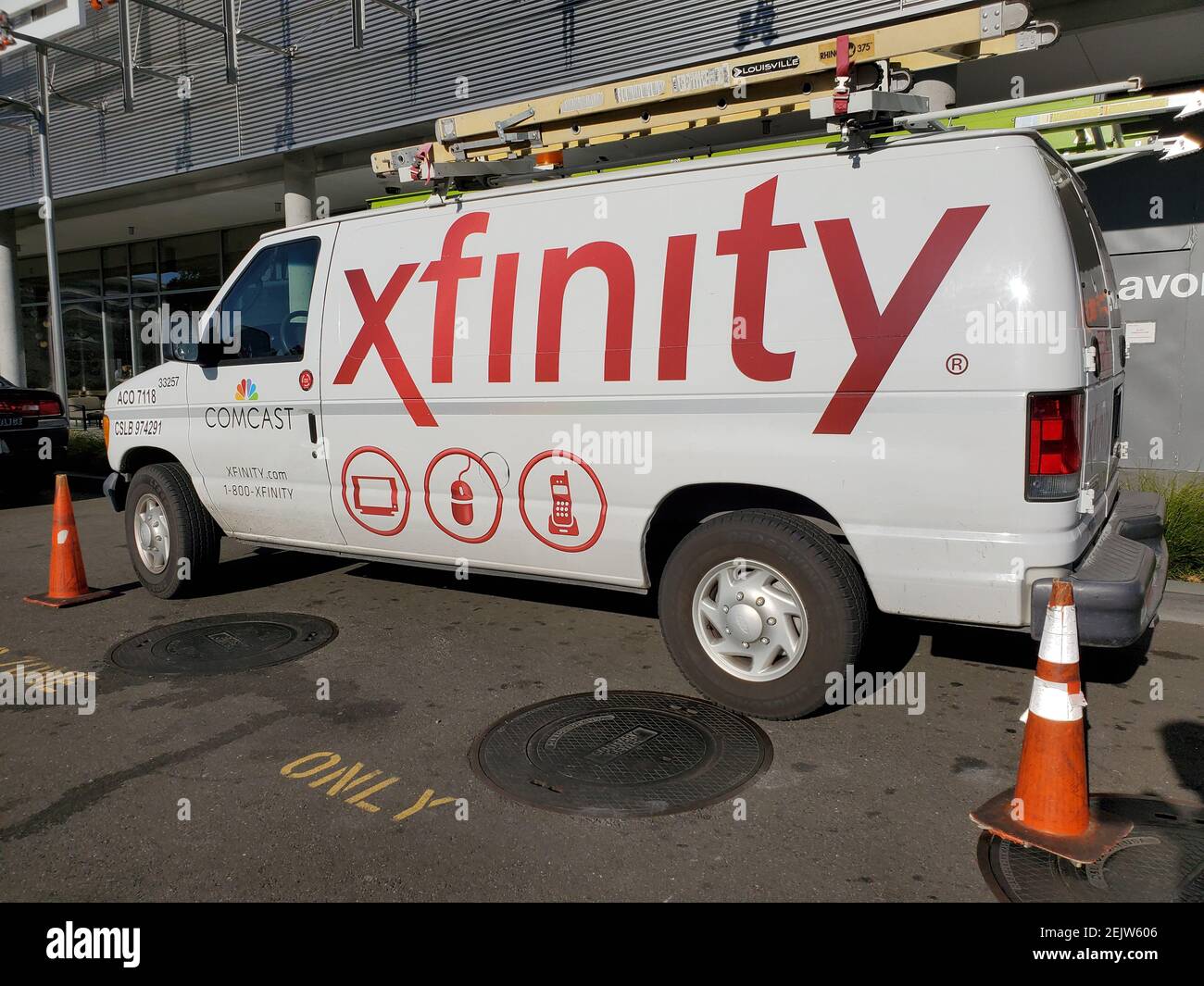 Side view of truck with logo for Xfinity, a division of internet ...