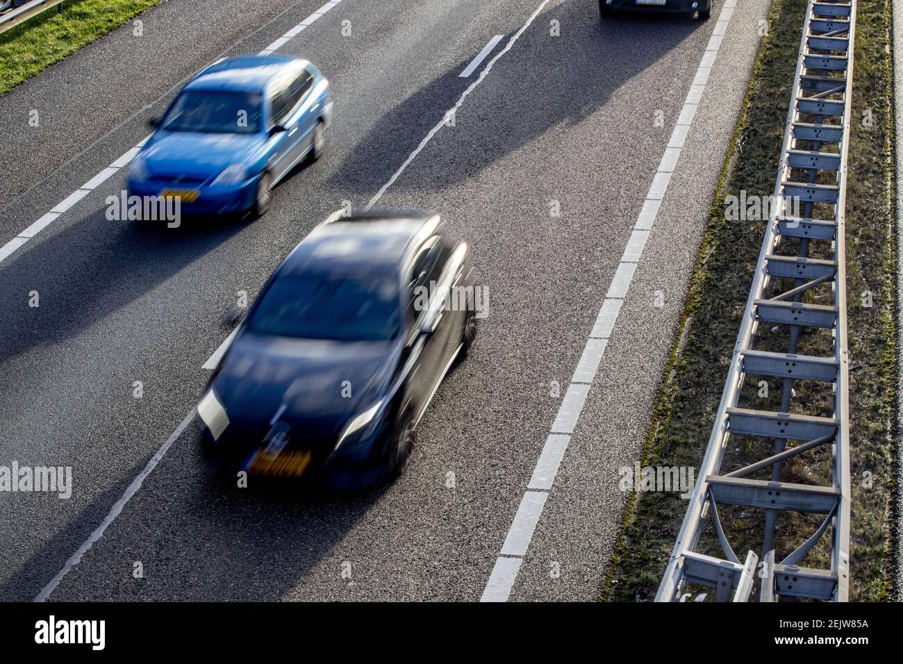 AMSTERDAM, A10, Traffic drives on the A10 along a 100 kilometer sign ...
