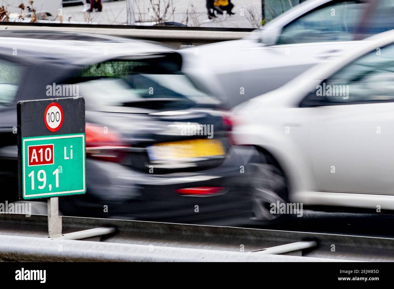 AMSTERDAM, A10, Traffic drives on the A10 along a 100 kilometer sign ...