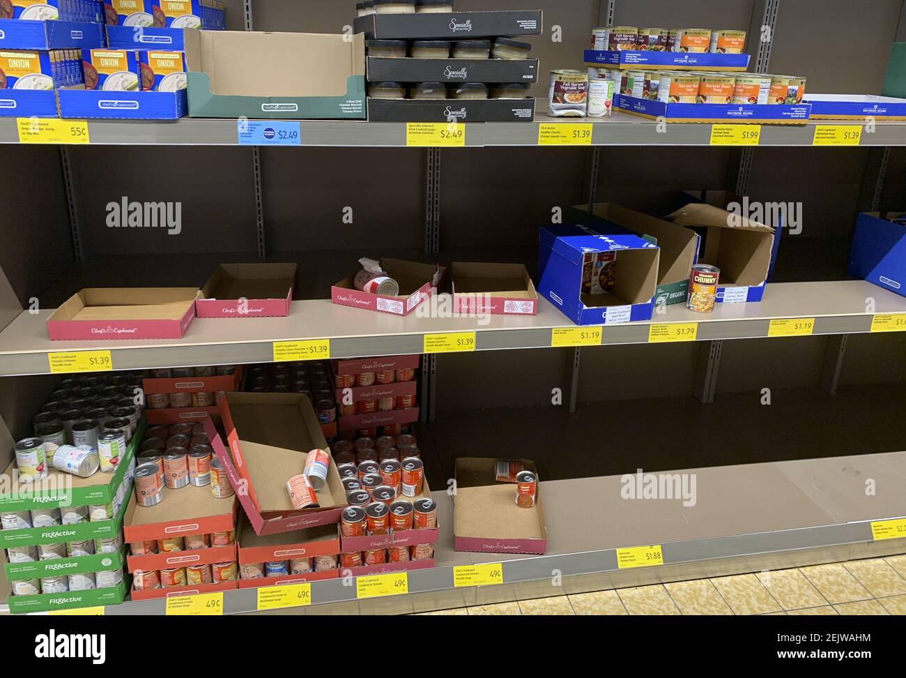 Food shelves are empty after shoppers panic buy food at an Aldi grocery ...