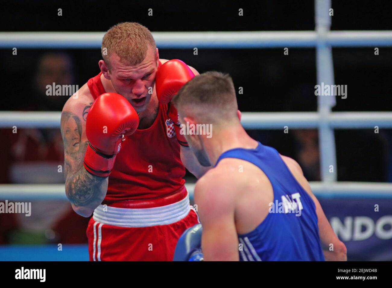 Luka Plantic of Croatia, wearing red and Umar Dzambekov of Austria ...