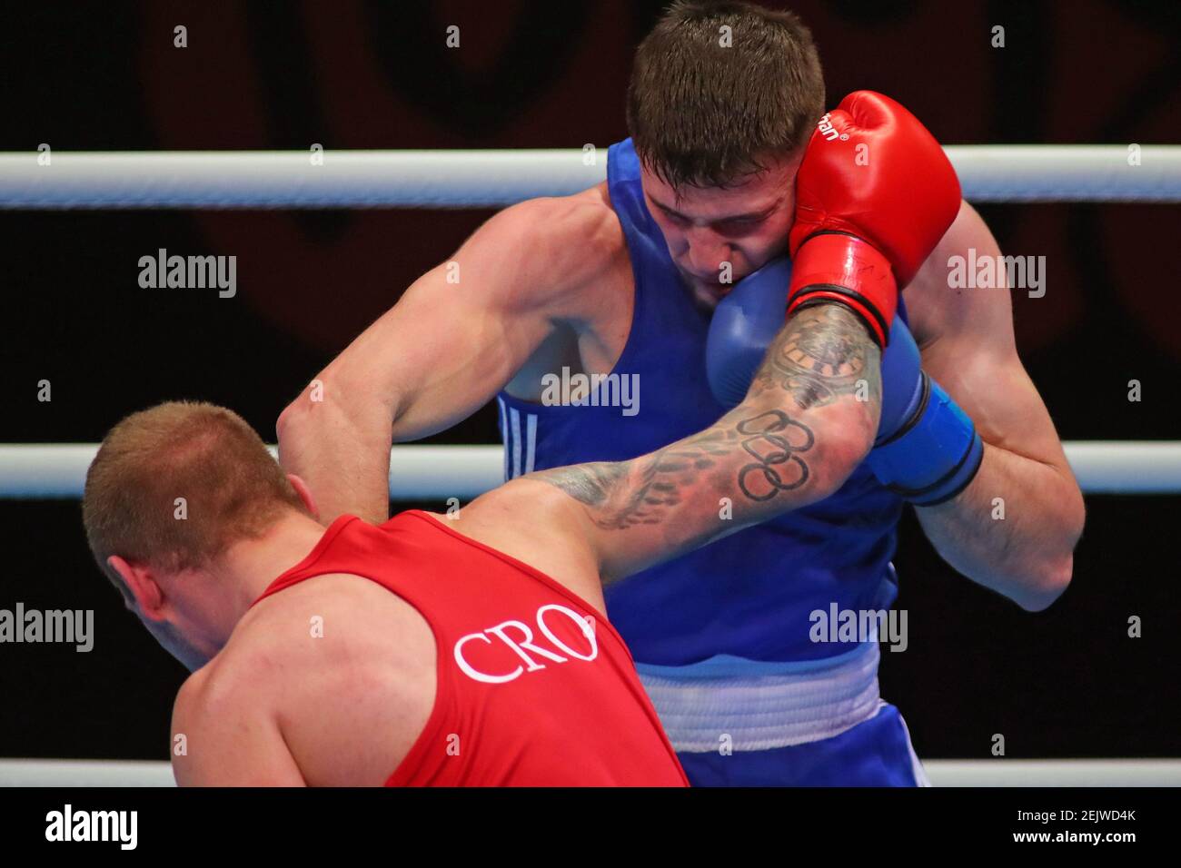 Luka Plantic of Croatia, wearing red and Umar Dzambekov of Austria ...