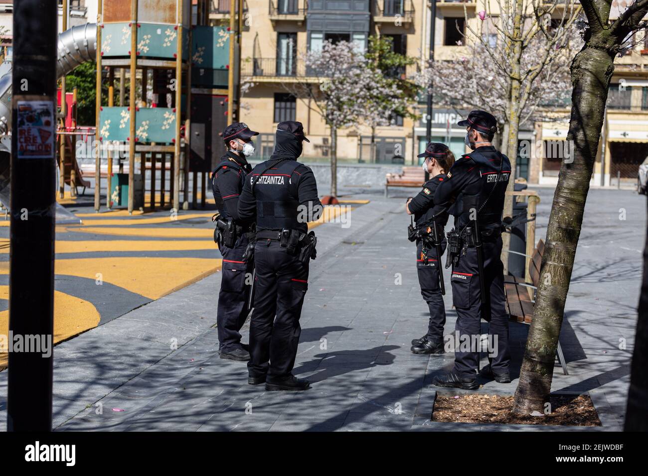 Several Basque police officers wearing face masks as a precaution ...