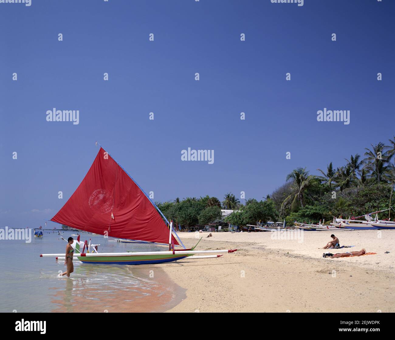 Asia, Indonesia, Bali colourful outrigger canoe on Sanur Beach Stock ...