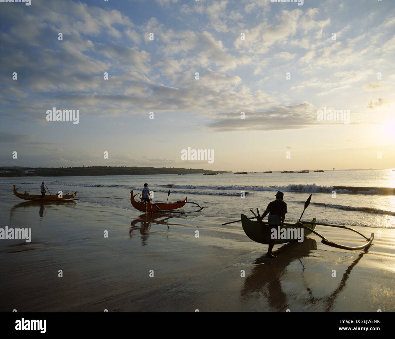 Asia, Indonesia, Bali island,Kuta beach,local fishermen with ...