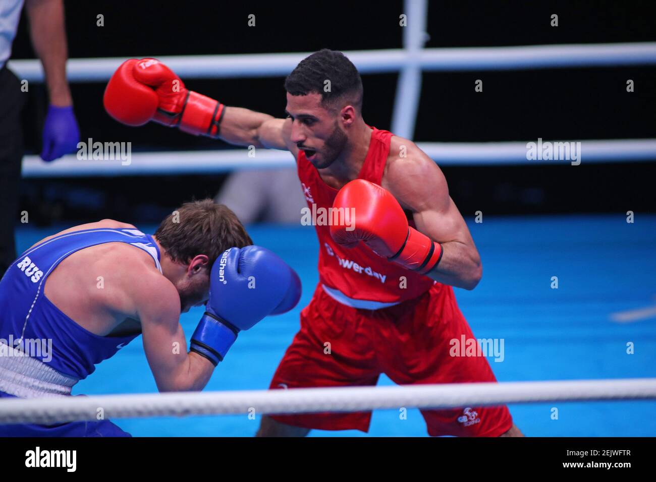 Galal Yafai of Great Britain, wearing Red and Rasul Saliev of Russia ...