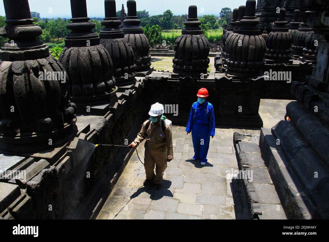 Officers of the Cultural Conservation Center (BPCB) DIY and TWC, spray disinfectants ...