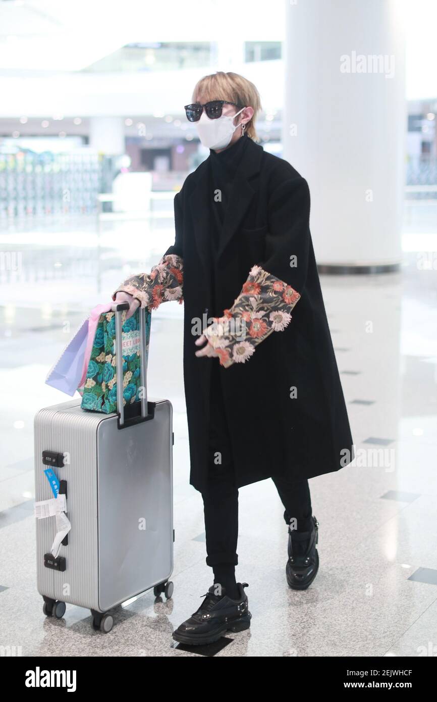 Liu Ye of Chinese idol boy band R1SE arrives at a Beijing airport after ...