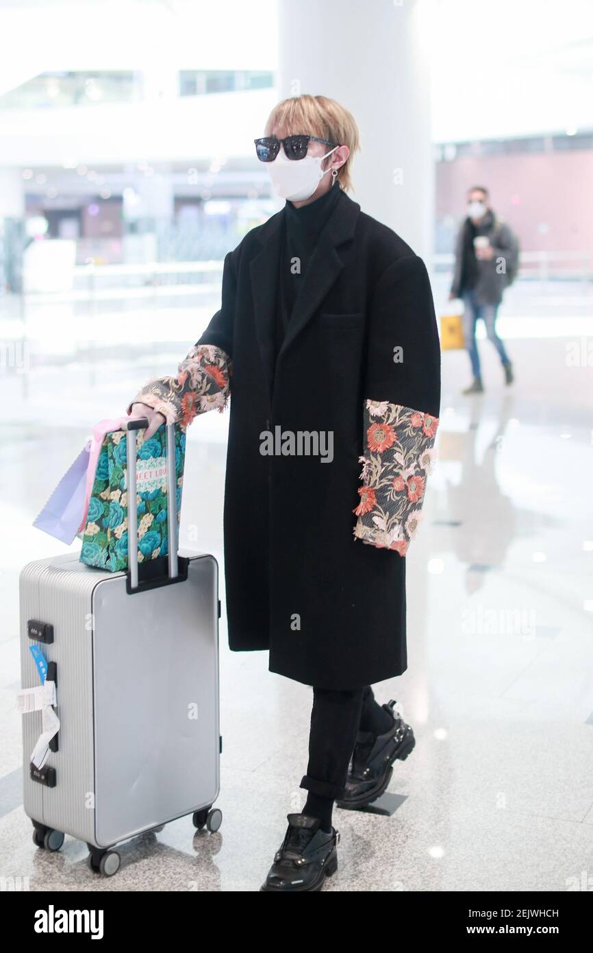 Liu Ye of Chinese idol boy band R1SE arrives at a Beijing airport after ...