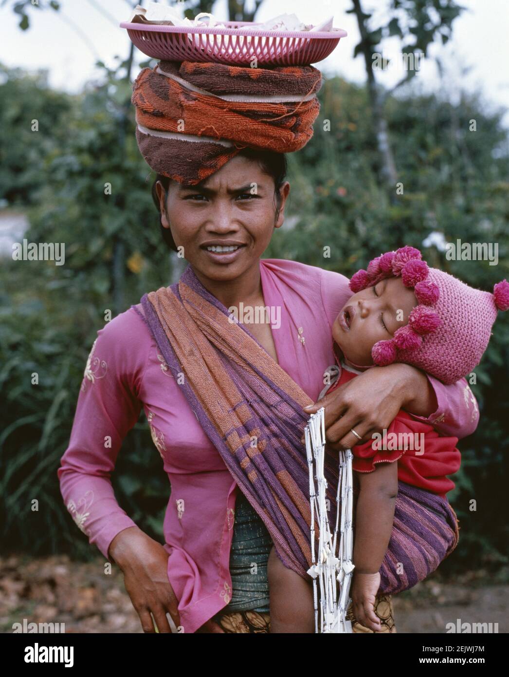 Asia,Indonesia, Bali, Ubud ,Balinese mother carrying baby and selling ...