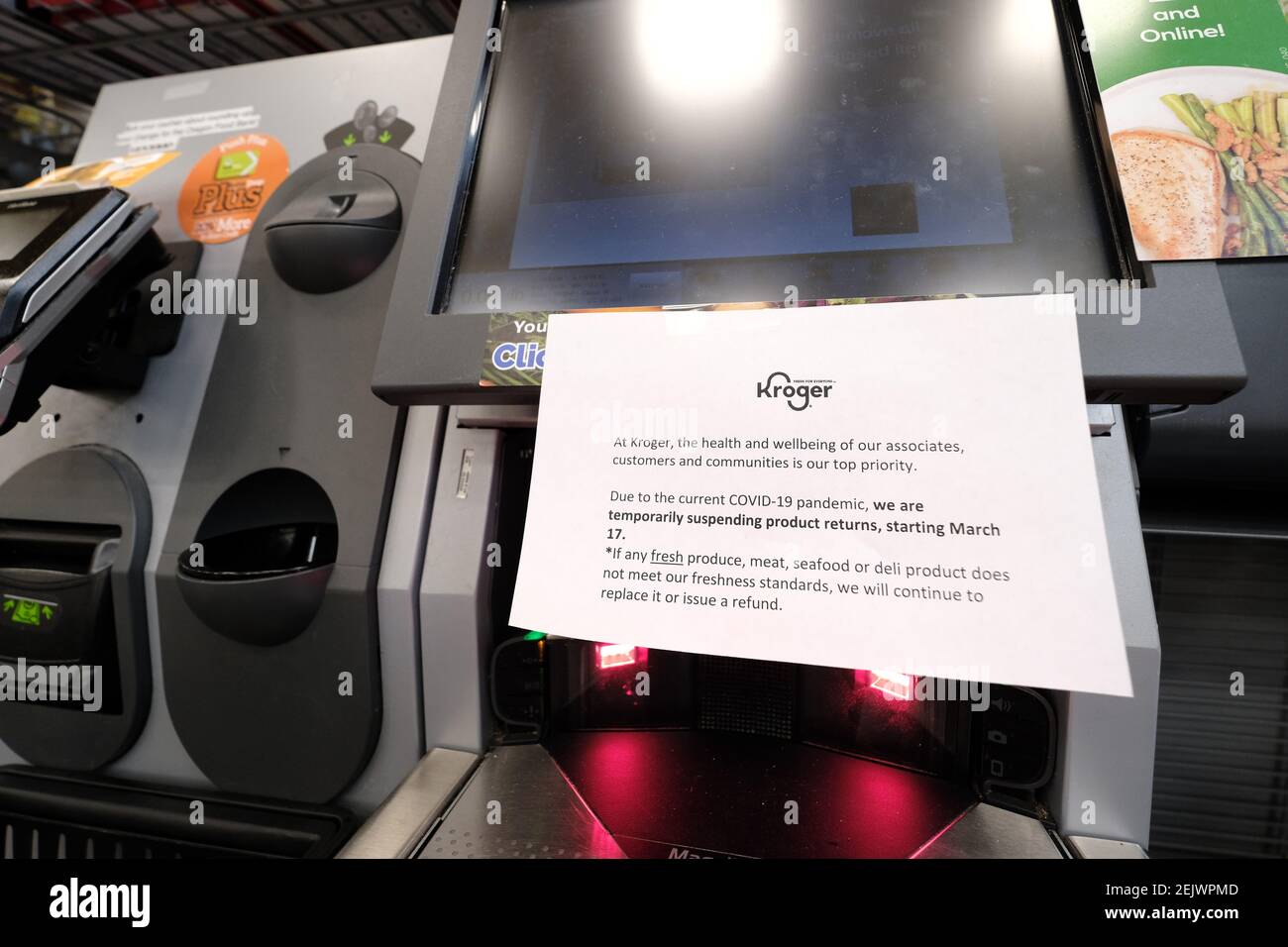 A sign on a self-checkout register informs customers that returns will ...