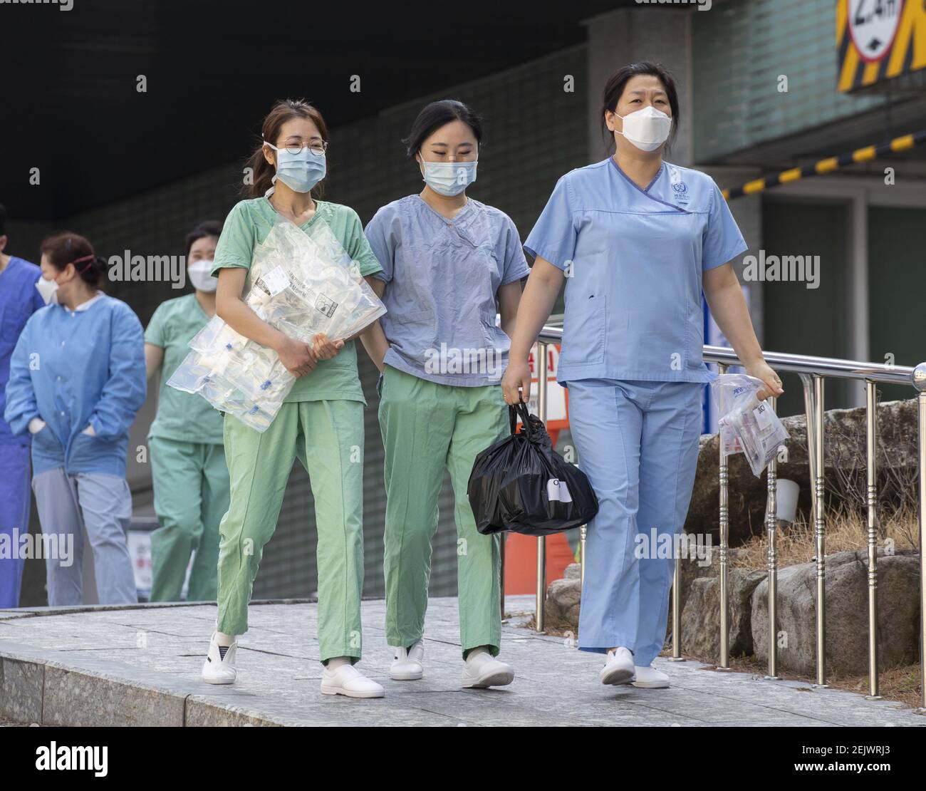 South Korean medical staff members arrive for a duty shift at Keimyung ...