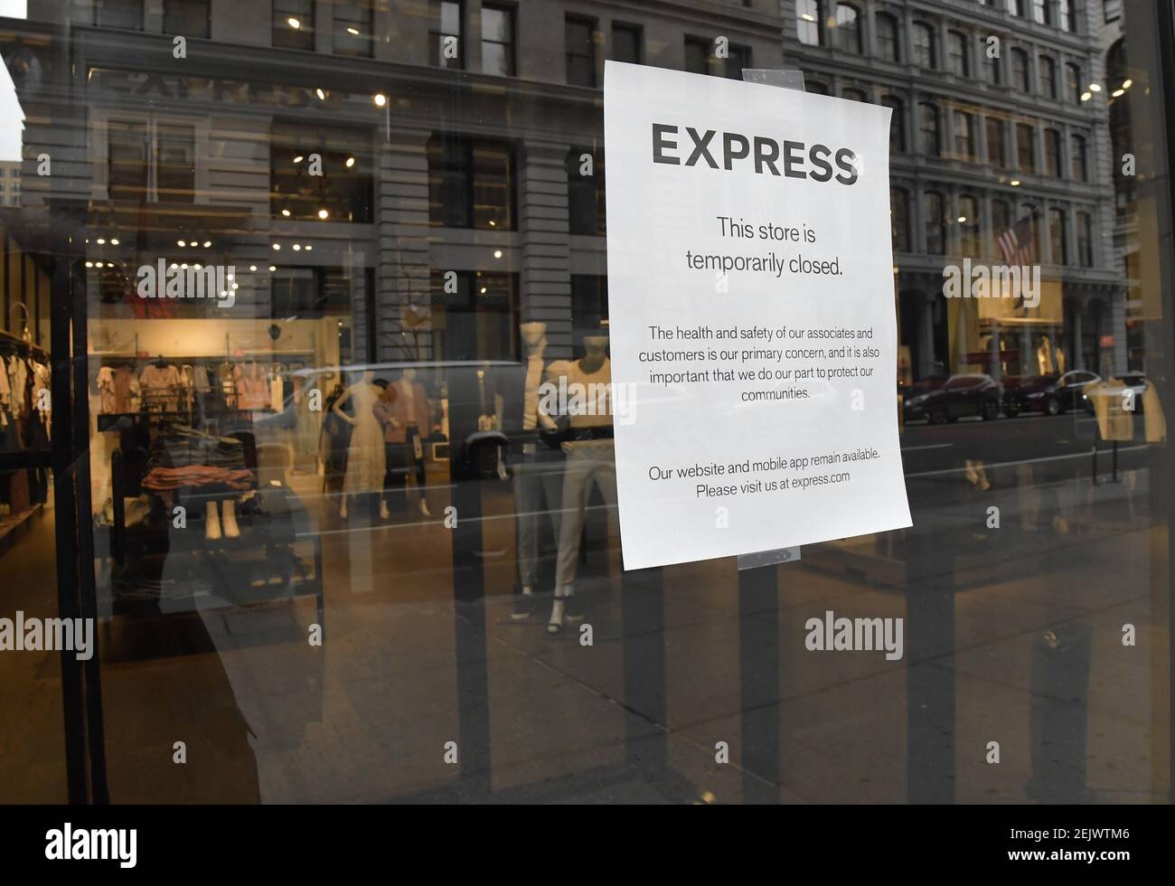 The sign of a closed Manhattan Fifth Avenue Express store is seen in ...