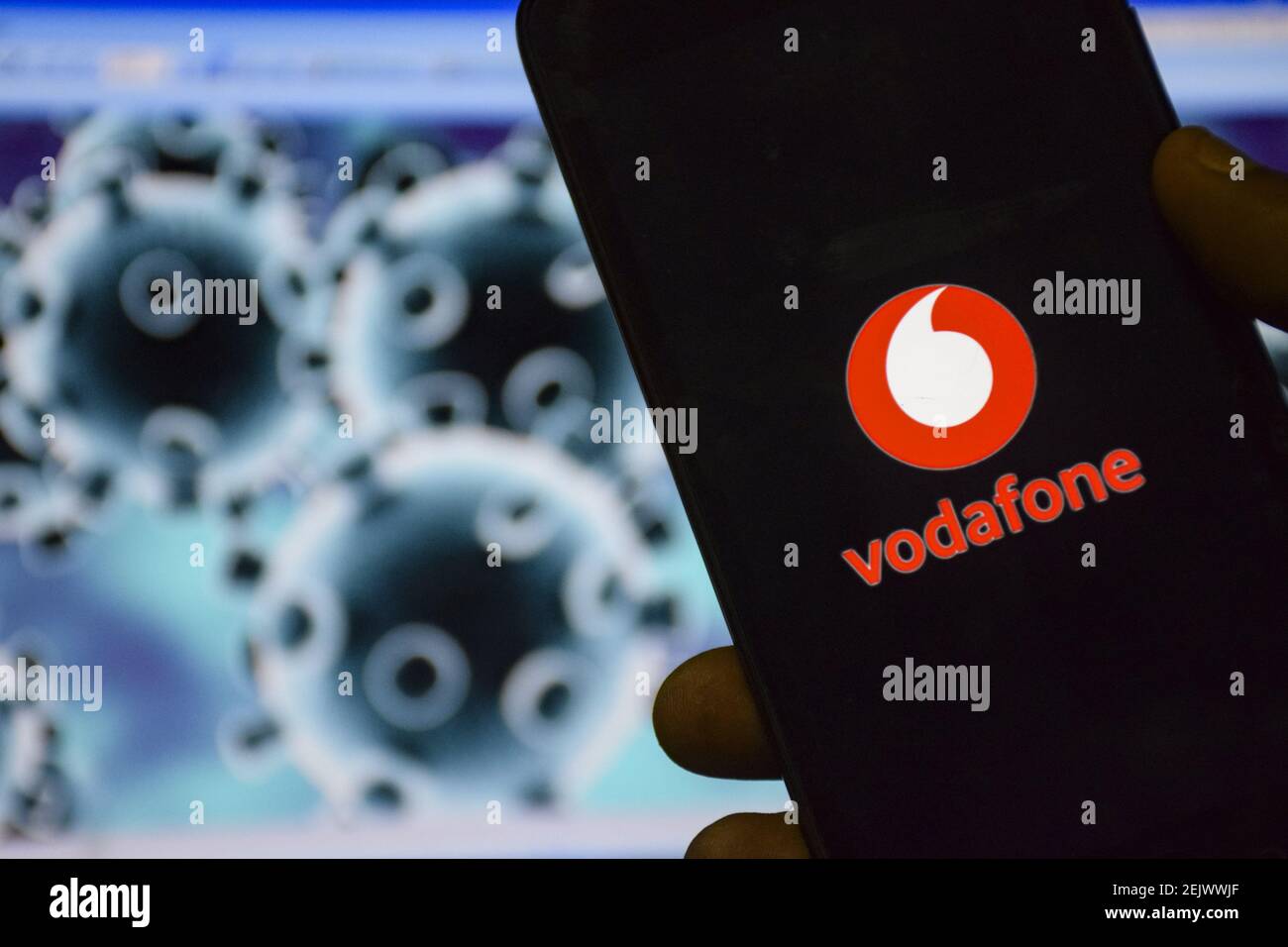 In this photo illustration the Vodafone logo seen displayed on a ...