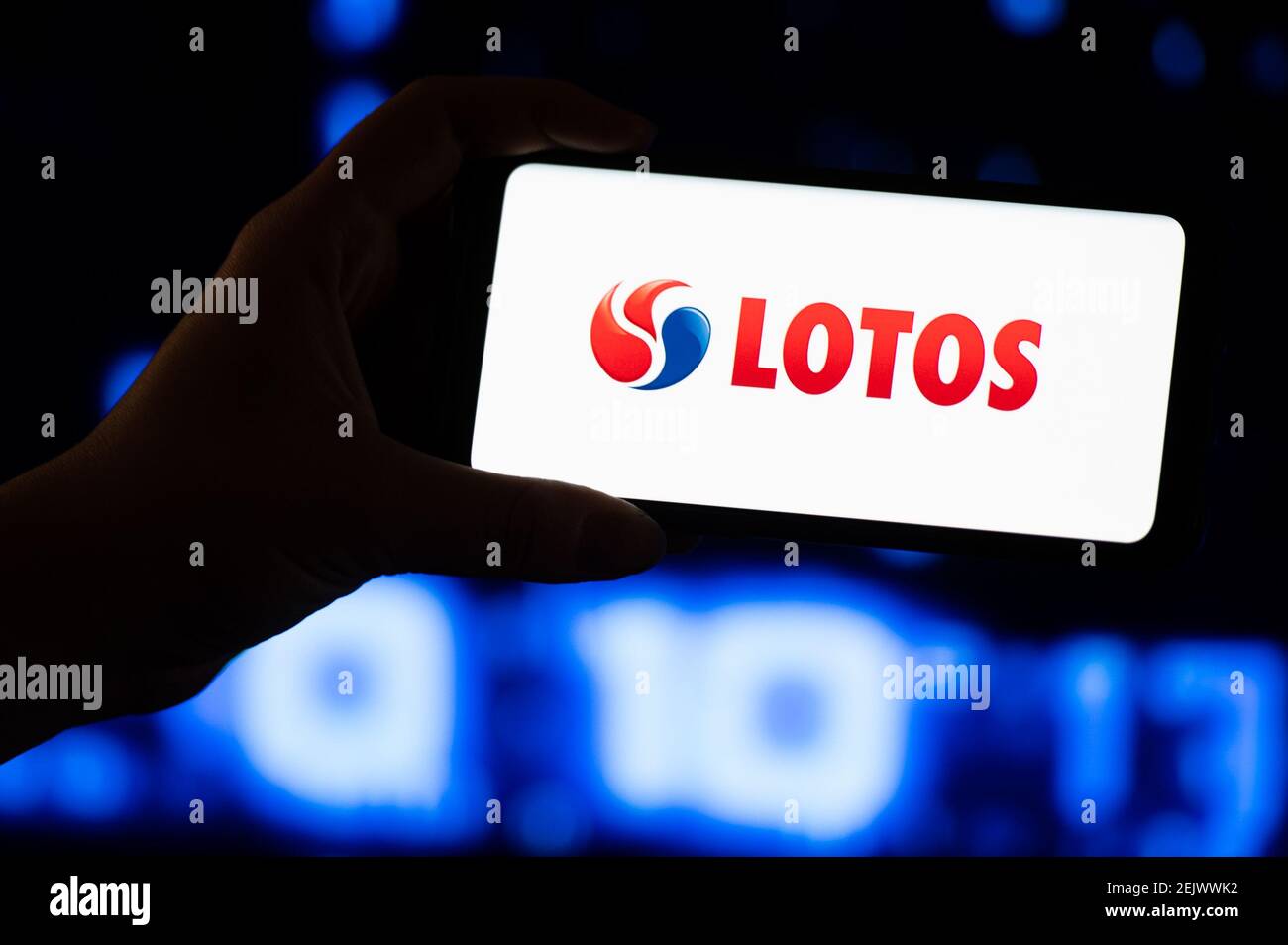 In this photo illustration a Lotos logo is seen displayed on a ...