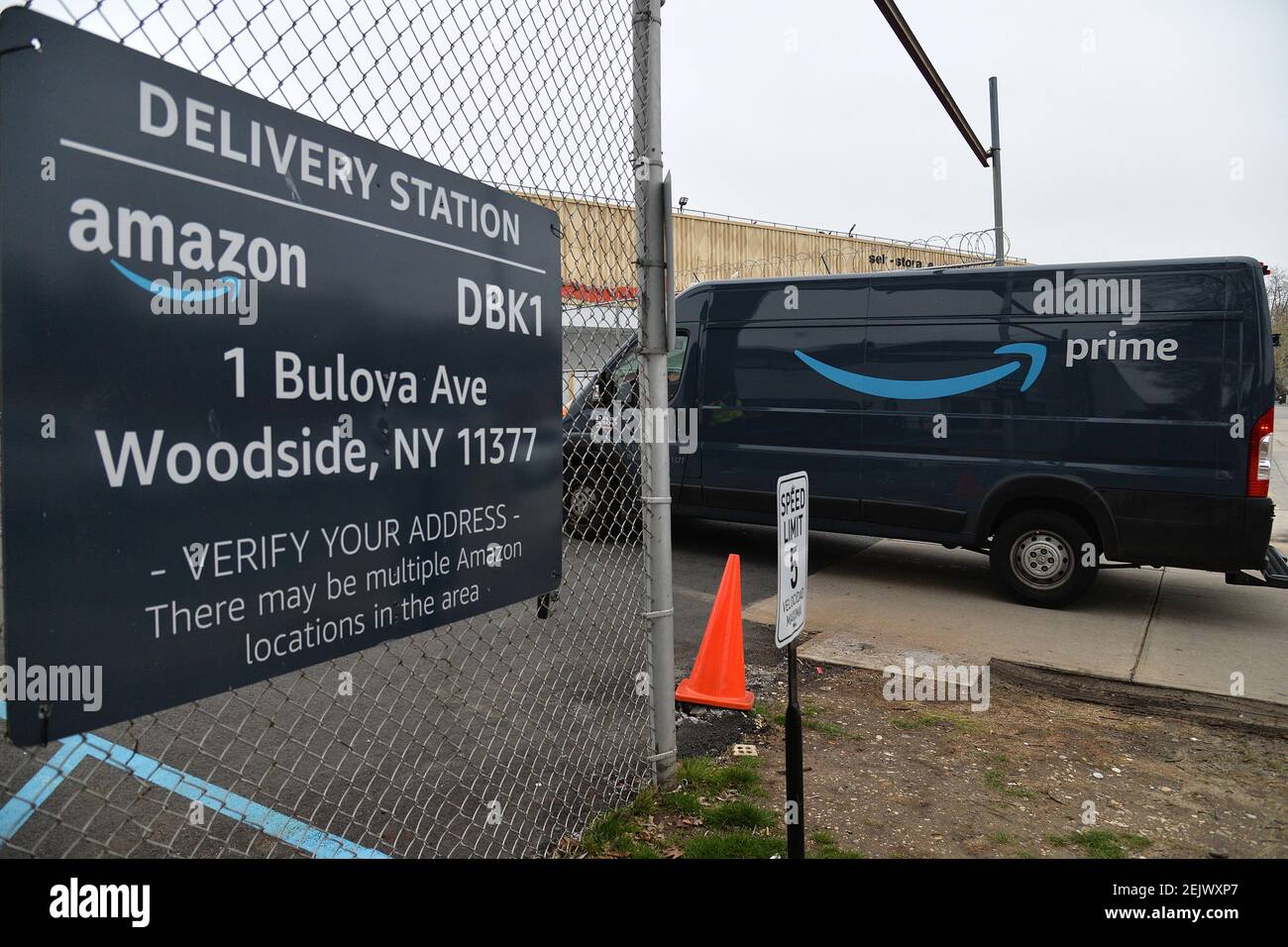 Vehicles and signs at the Amazon delivery station in Queens, New York ...