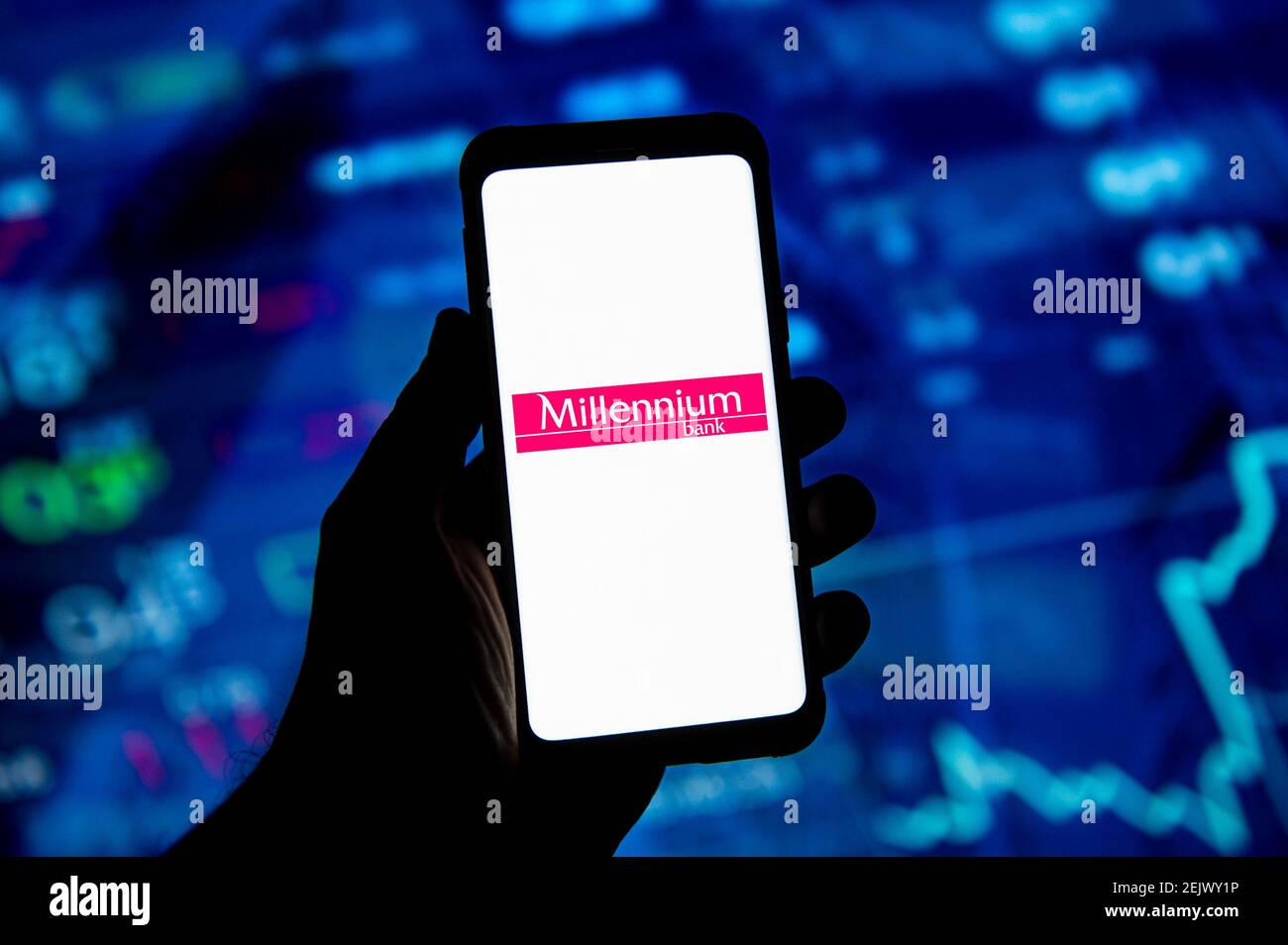 In this photo illustration a Millenium Bank logo seen displayed on a ...