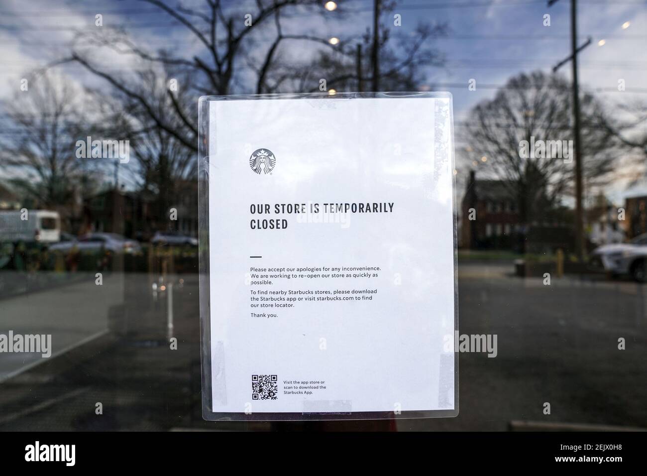 A sign announcing store closure is posted in window of a Starbucks in ...