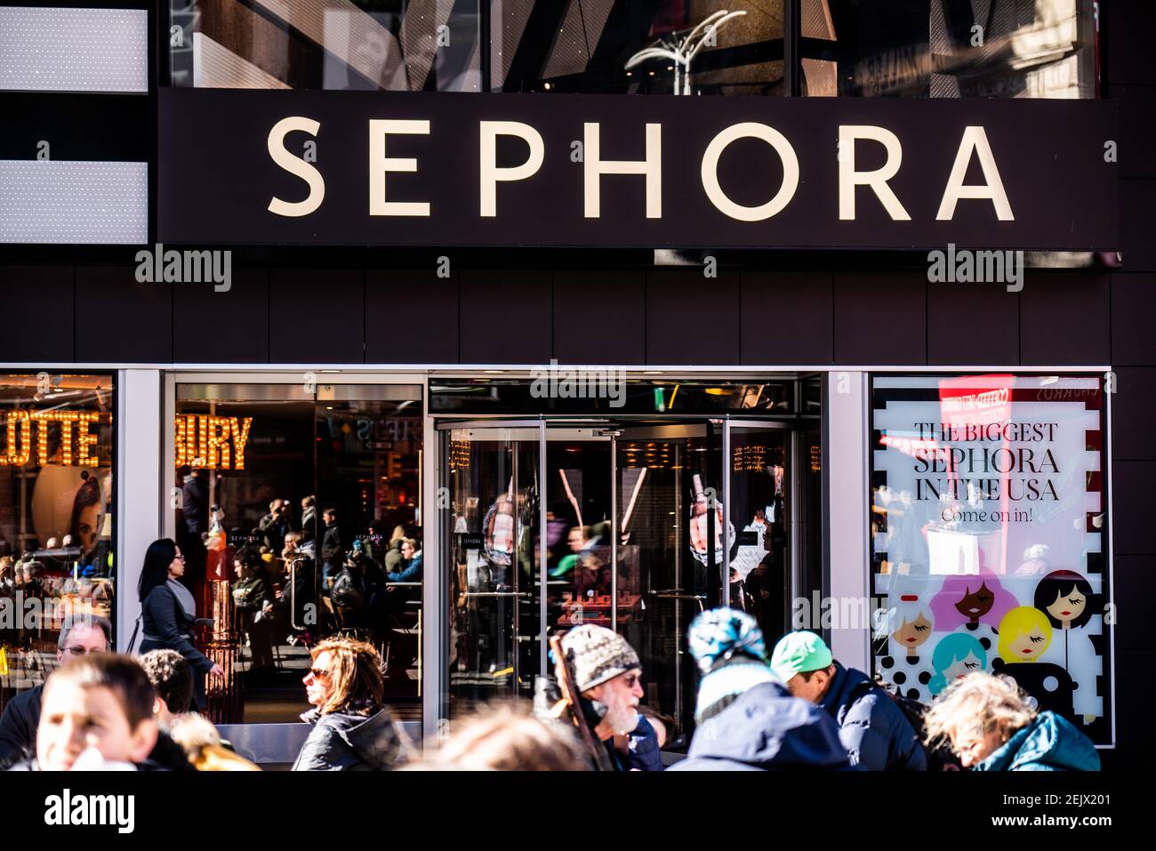 Pedestrians walk past a French multinational chain of personal care and ...