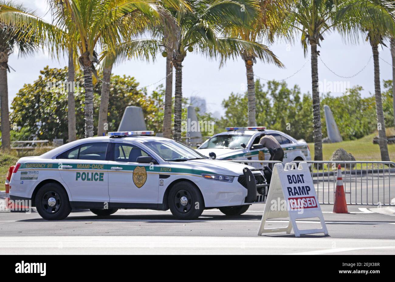 Miami-Dade police at the entrance of the Pelican Harbor Marina, which ...