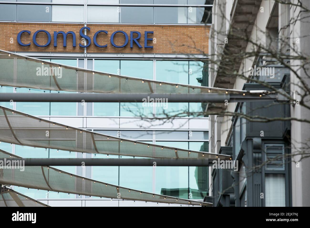 A logo sign outside of the headquarters of Comscore in Reston, Virginia ...