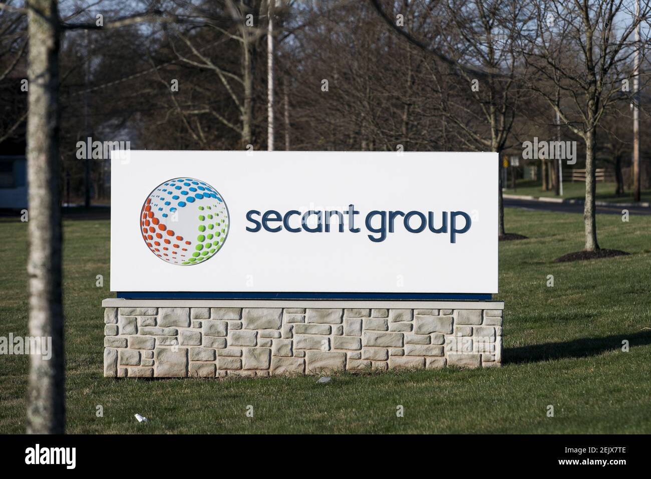 A logo sign outside of a facility occupied by the Secant Group in ...