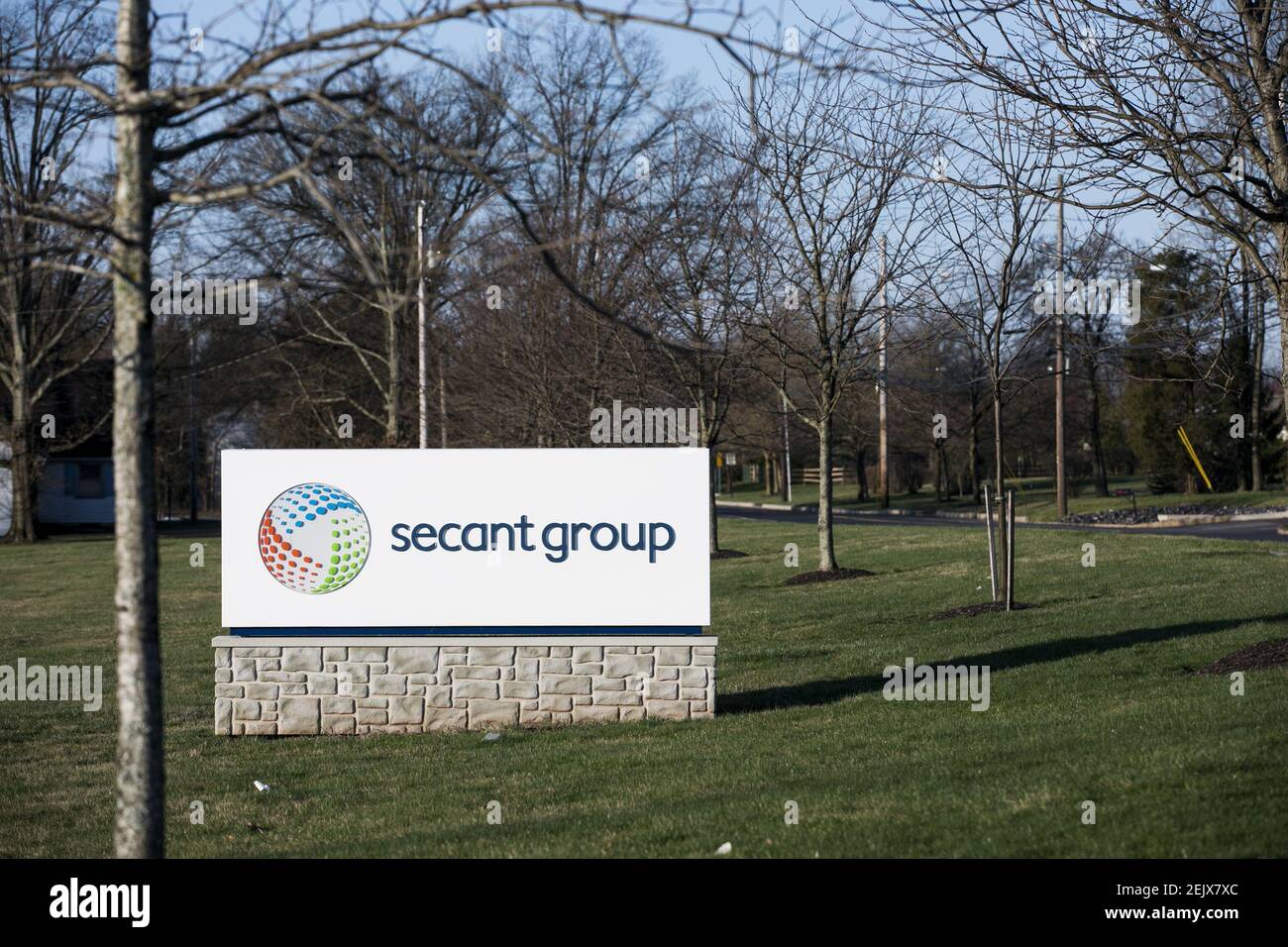 A logo sign outside of a facility occupied by the Secant Group in ...