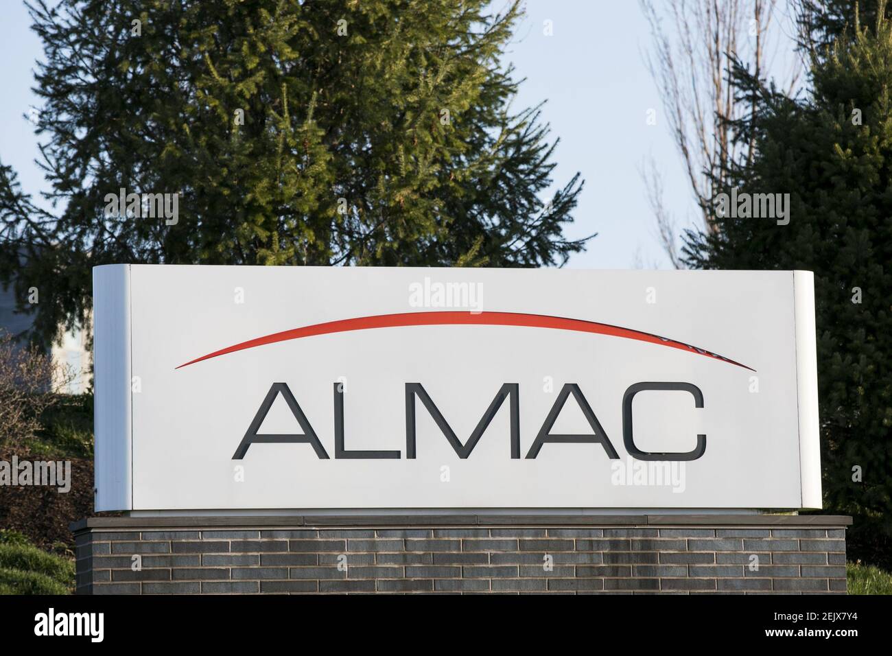 A logo sign outside of a facility occupied by Almac in Souderton ...